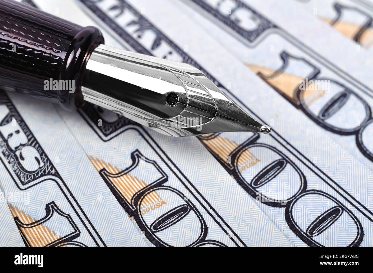 metal nib pen and dollar bill, close up Stock Photo - Alamy
