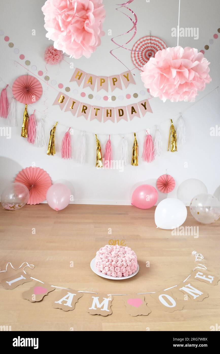 Birthday Party Decoration of a one year old Girl with a cake and balon ...