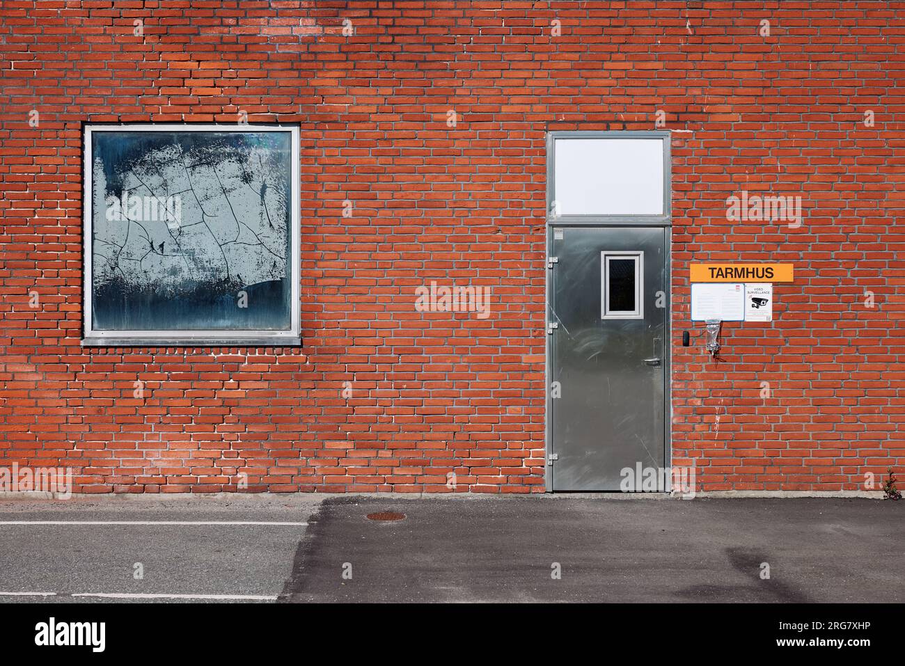 Danish Crown Slaughterhouse, "Tarmhus", sign by door in red brick wall ...