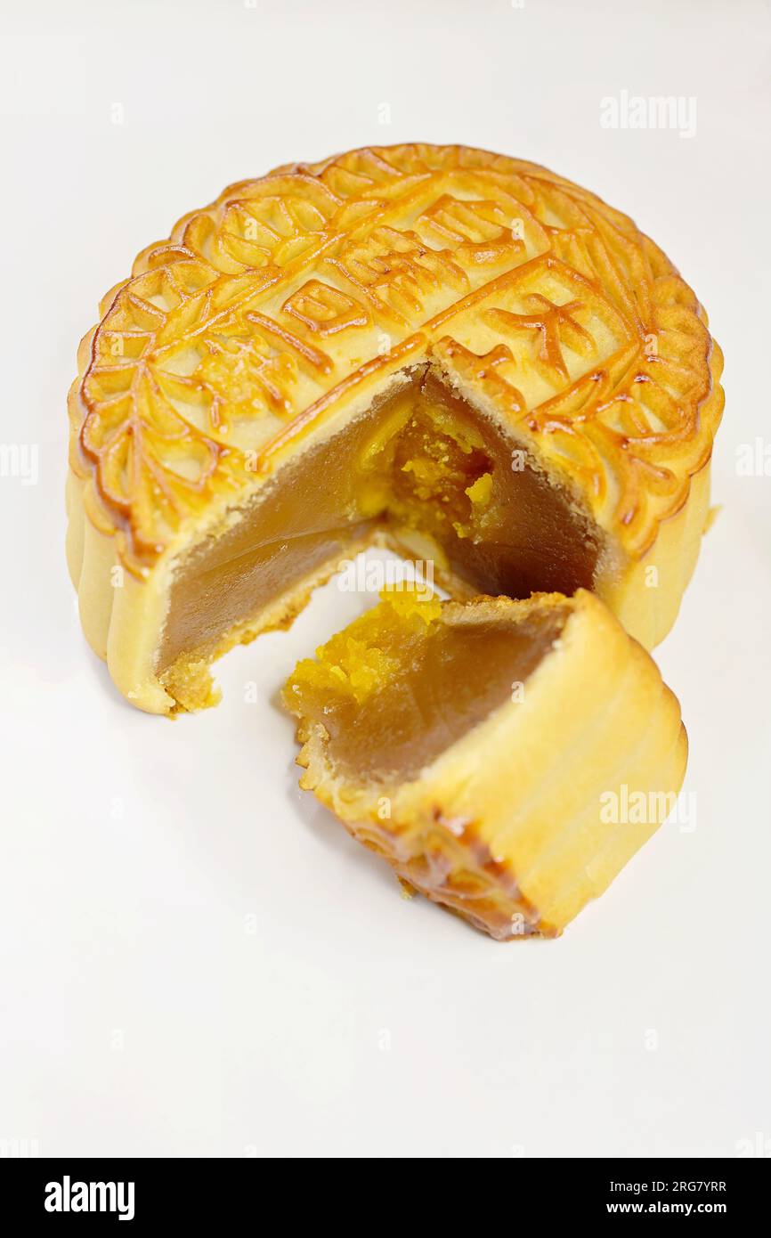 Top view of a baked Chinese mooncake with lotus seed paste and cut ...