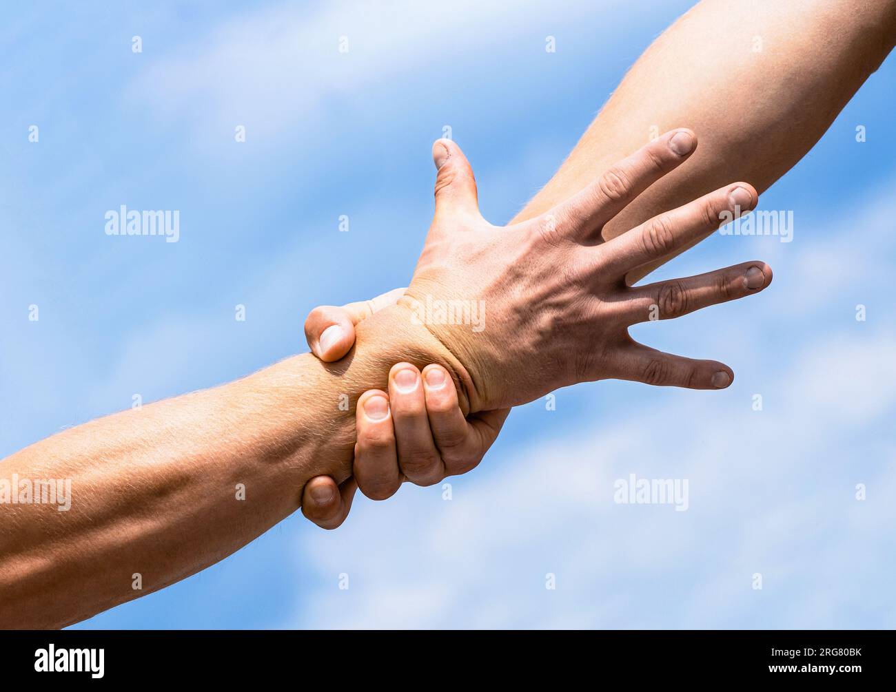 Friendly handshake. Two hands, shaking hands. Rescue, helping gesture or hands. Close up help ...