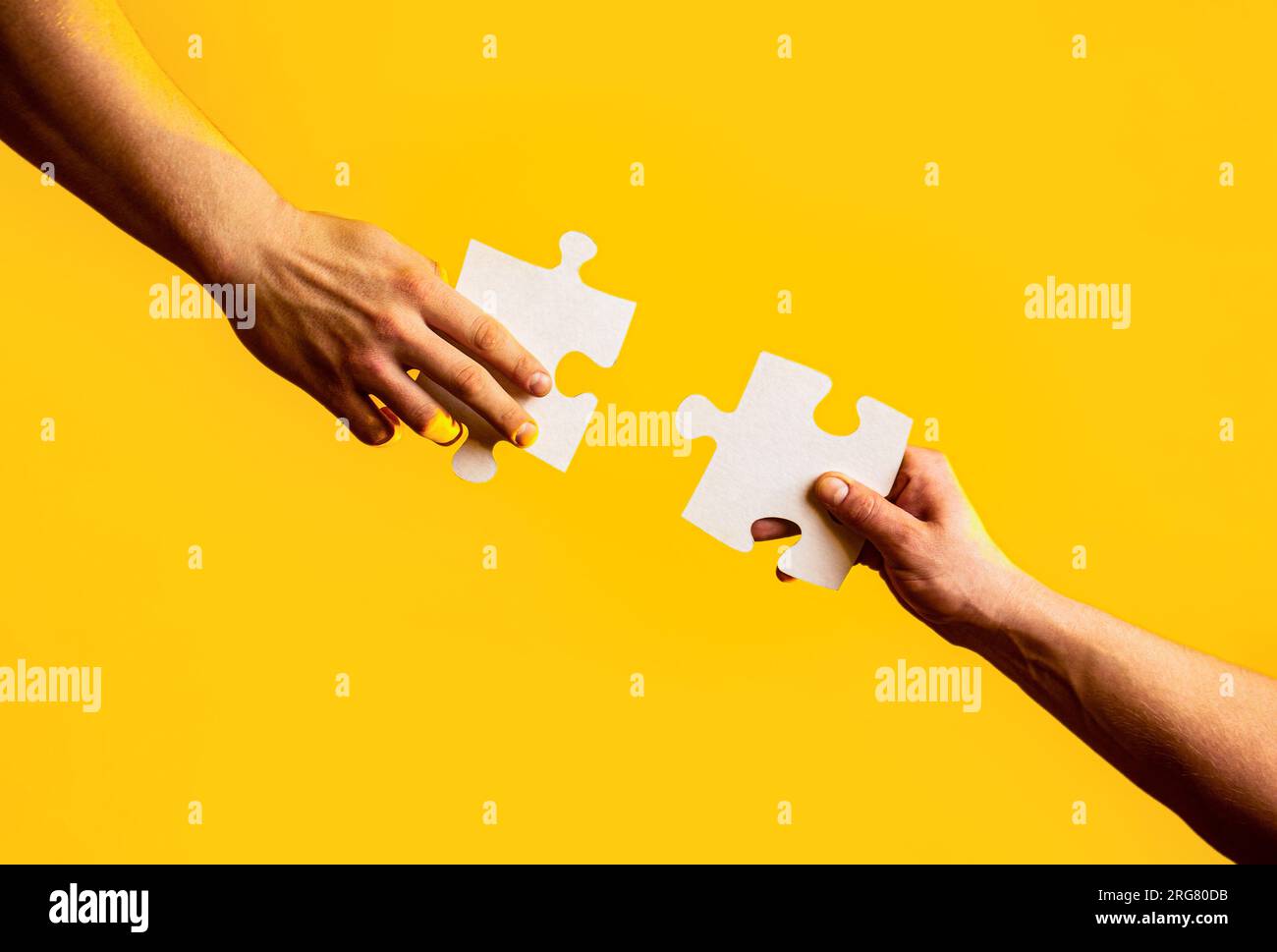 Business solutions, success and strategy concept. Two hands trying to ...