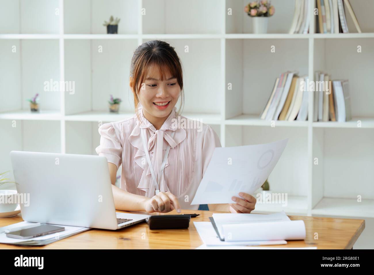 employee with paper work inside office, female financier worker thinks ...