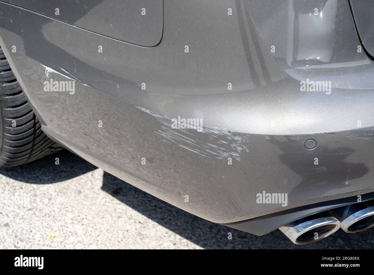 Big scratch on the bumper Stock Photo - Alamy