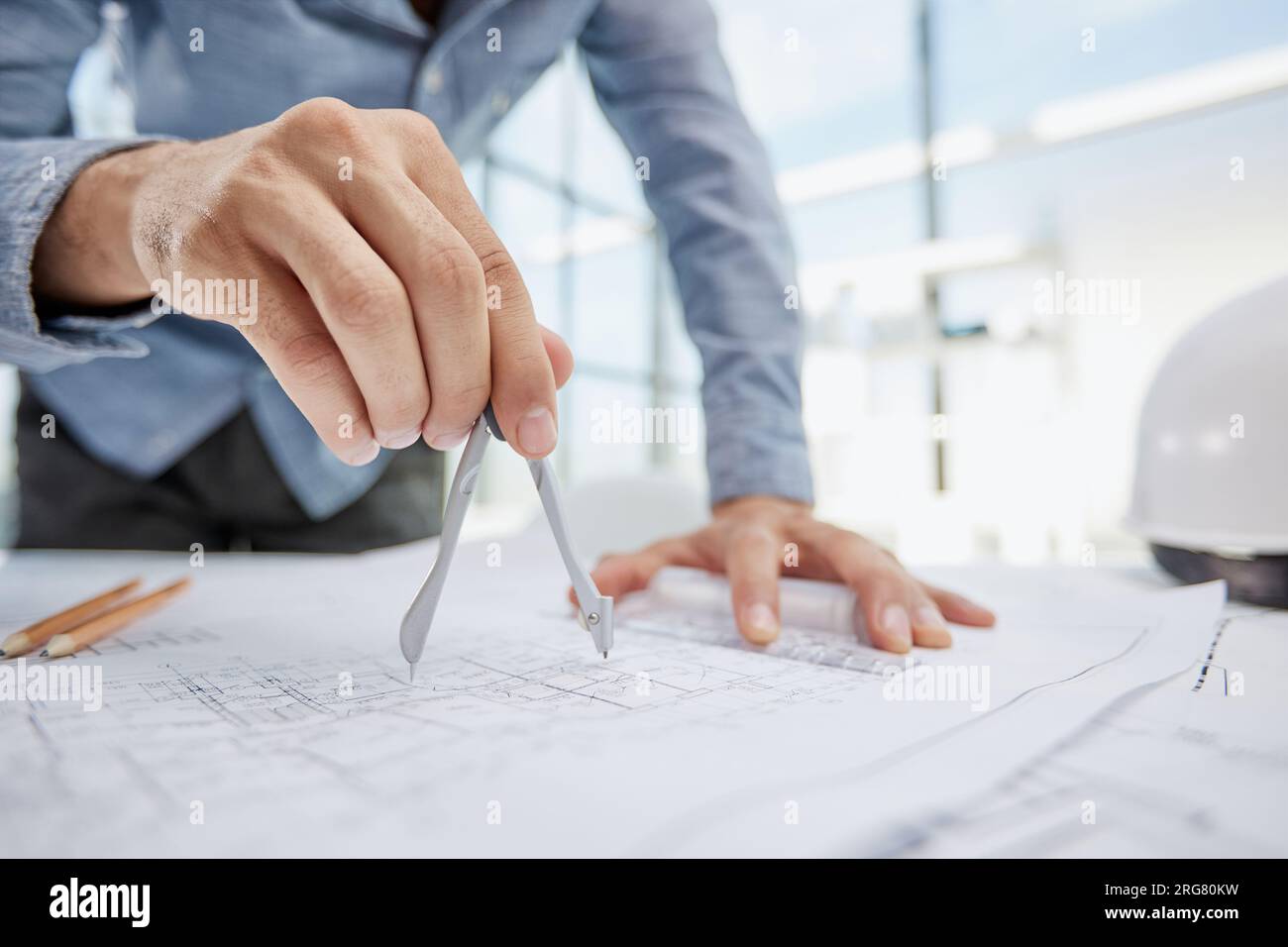 Young handsome architect engineer working on design plan Stock Photo ...