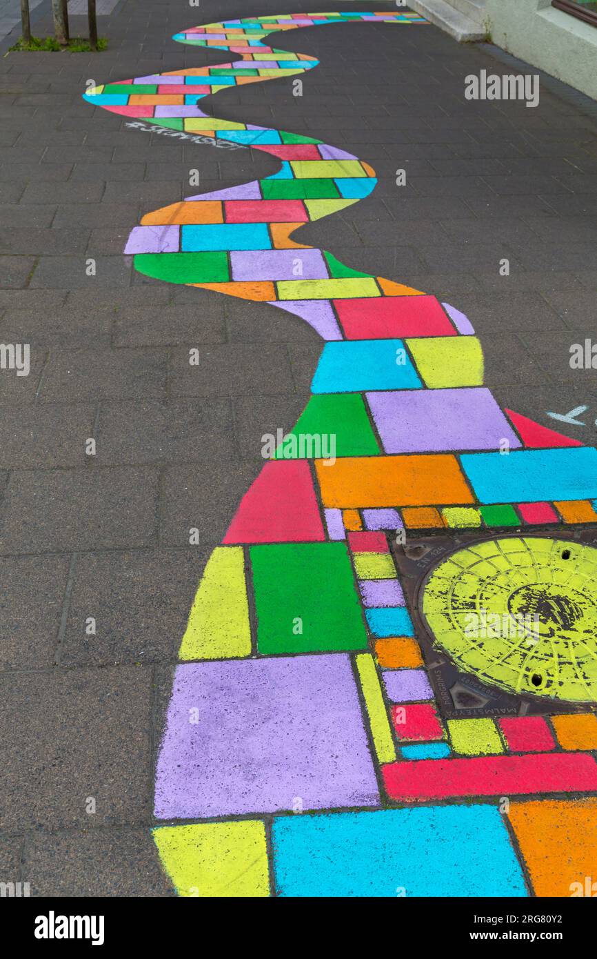 Street art on pavement at Reykjavik, Iceland in July Stock Photo - Alamy