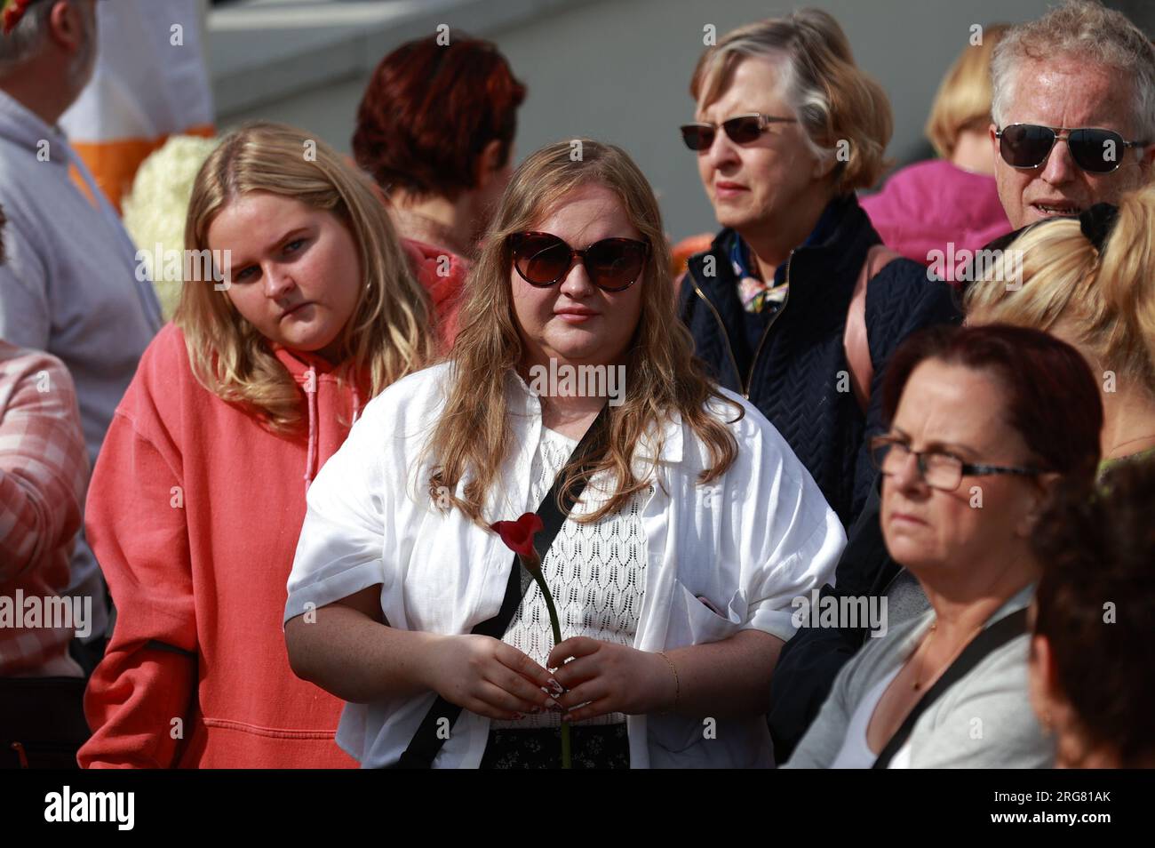 Sinead O'Connor fan, Emily O'Shea (centre), stands outside the former ...