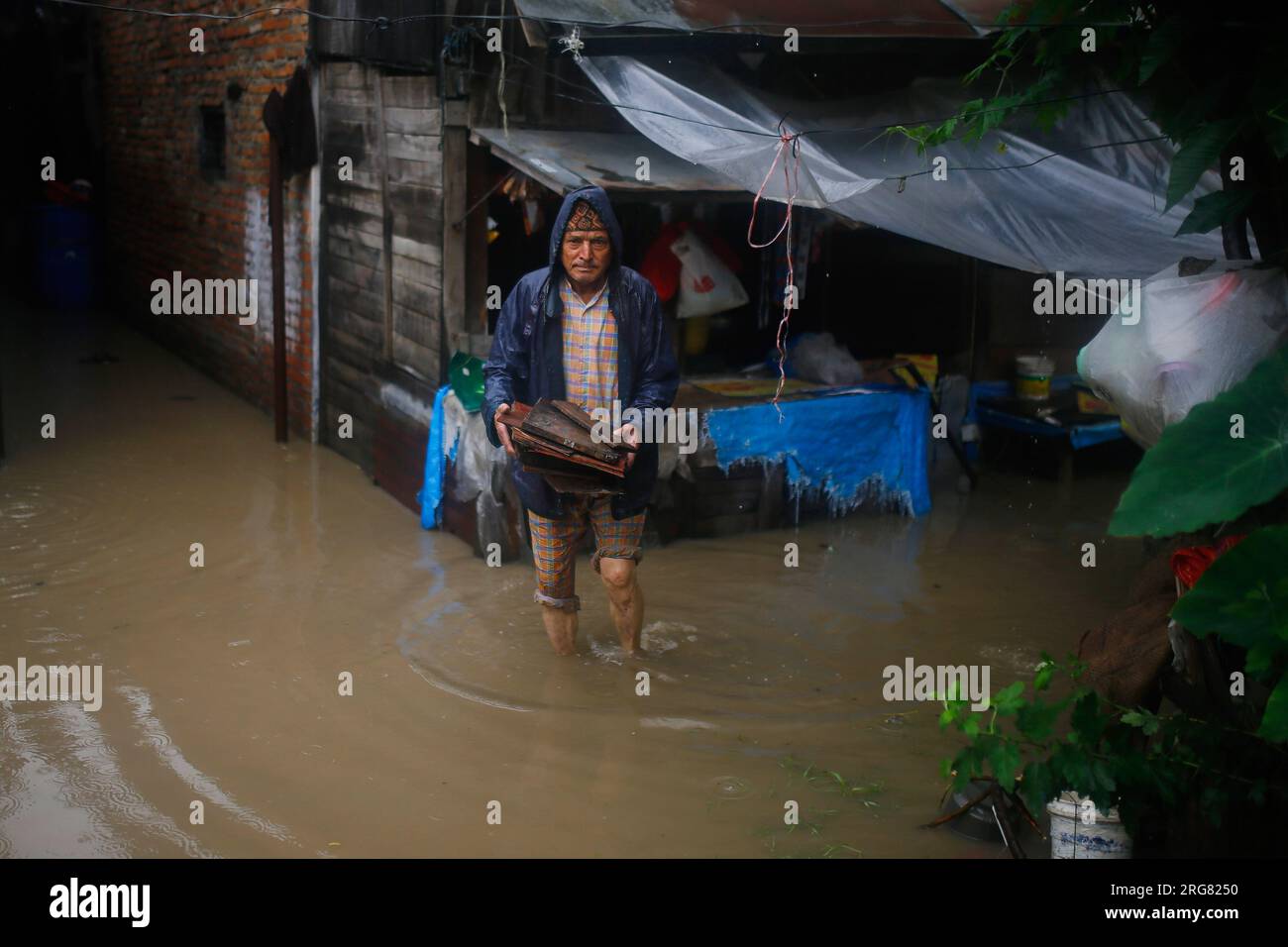 Kathmandu, Nepal. 08th Aug, 2023. A man carrying leftovers outside her ...