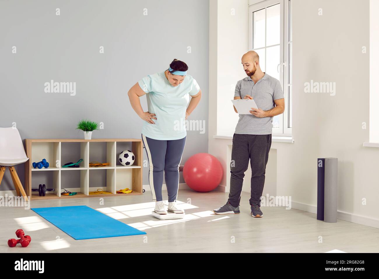 Checking body fat man hi-res stock photography and images - Alamy