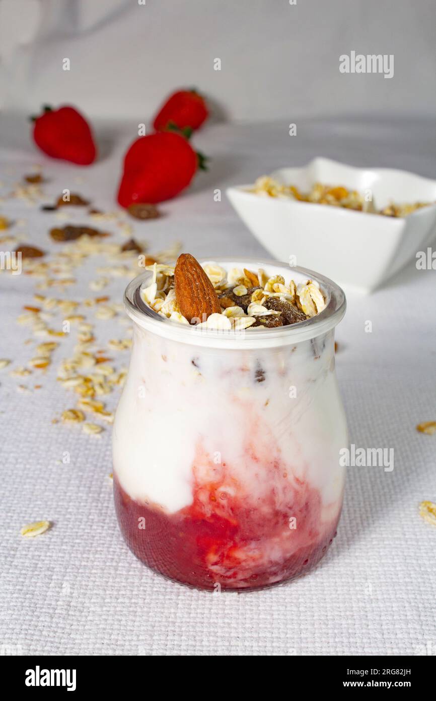 Delicious and healthy still life of yogurt and muesli, with ...