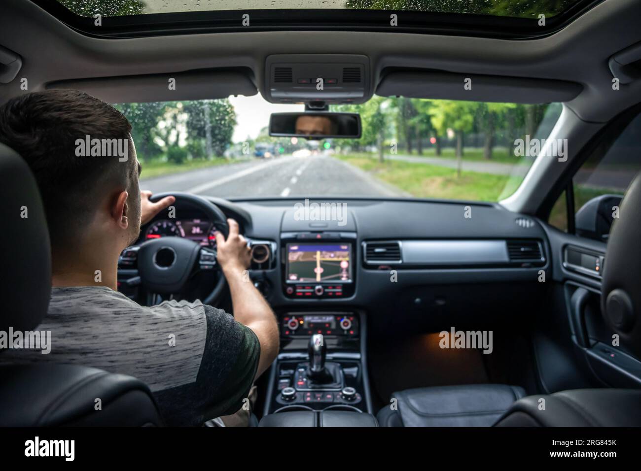 Hands on the wheel when driving from inside the car Stock Photo - Alamy