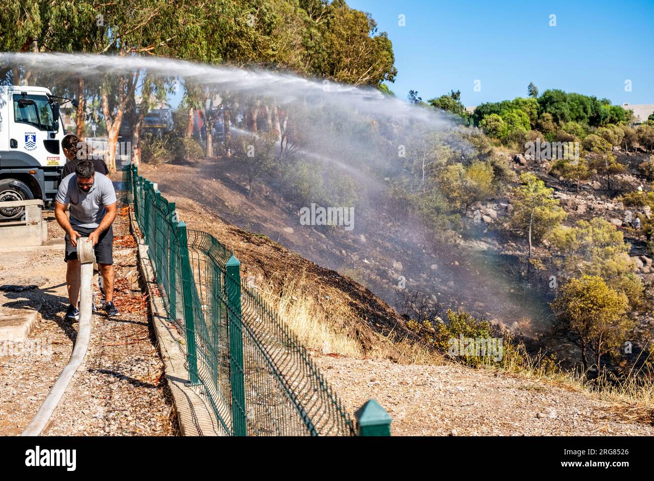 Bodrum,Turkey, 08.08.2023: Civil man helping fire department ...