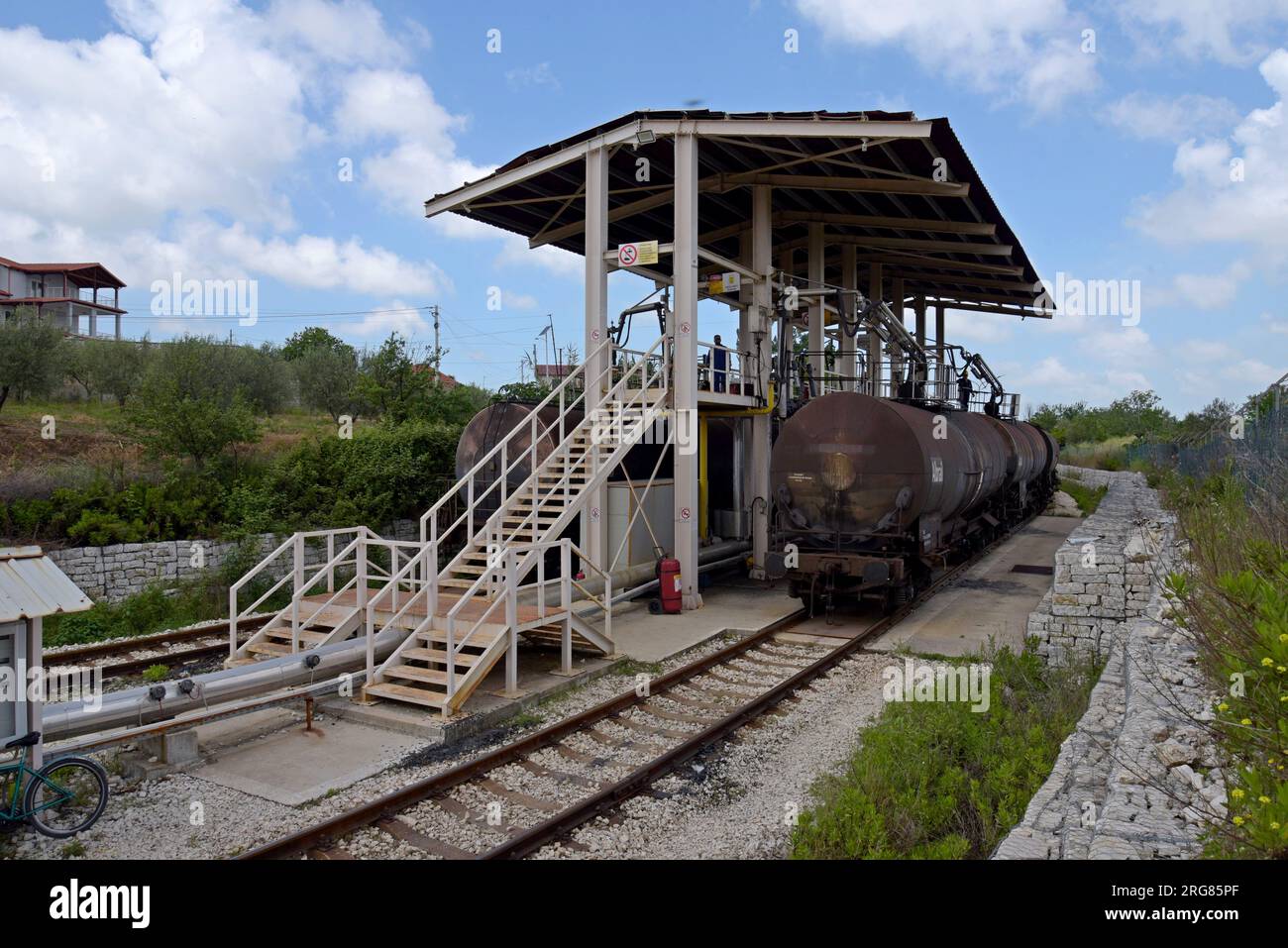 Filling oil tank wagons at the Albrail oil loading facility at Fier oil ...