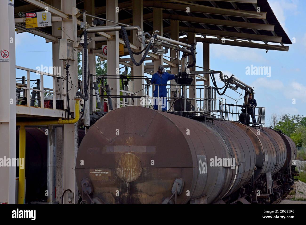 Filling oil tank wagons at the Albrail oil loading facility at Fier oil ...