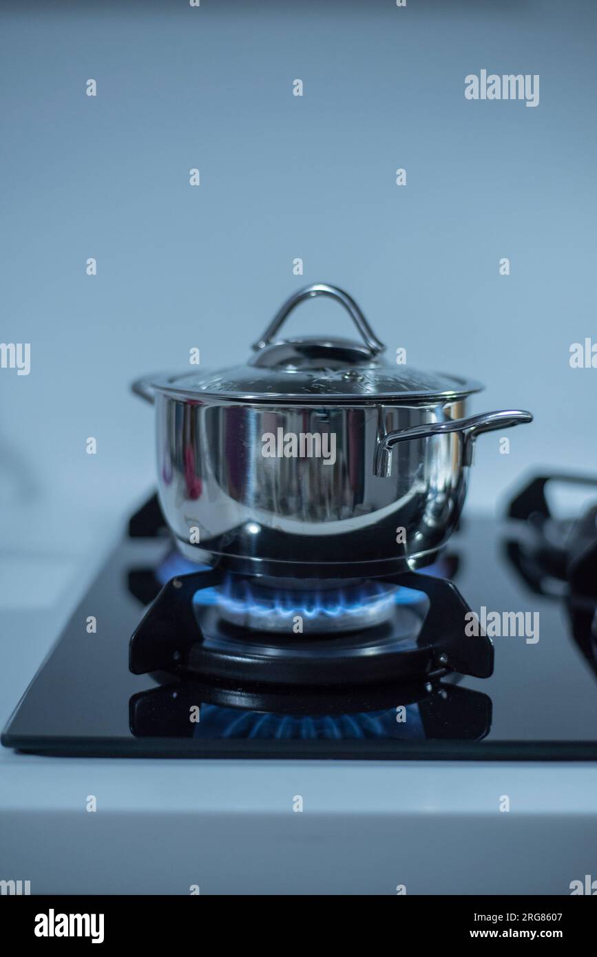 Pot on top stove blue hi-res stock photography and images - Alamy