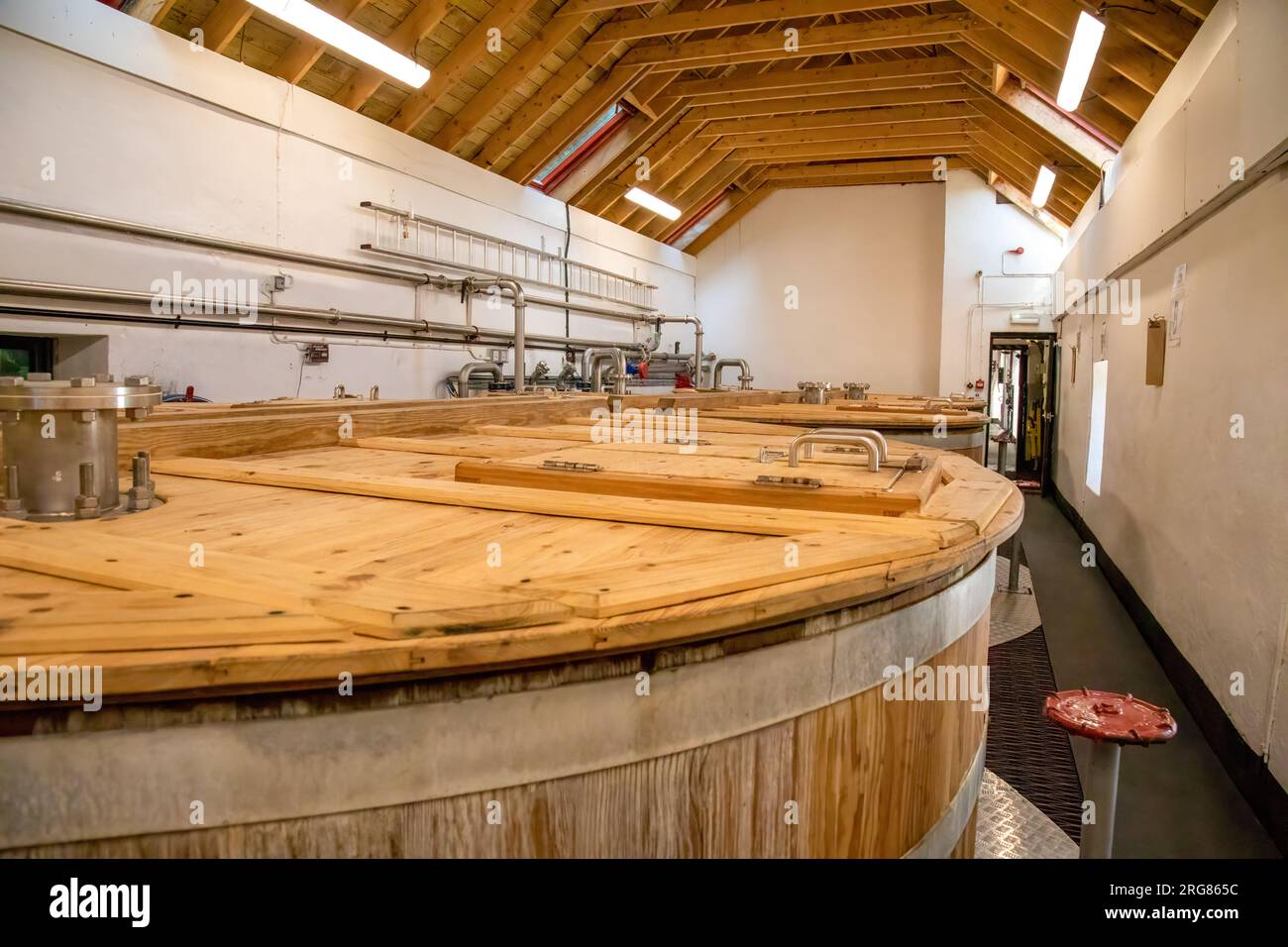 Inside a whisky distillery with vats made of wood in a warehouse Stock ...