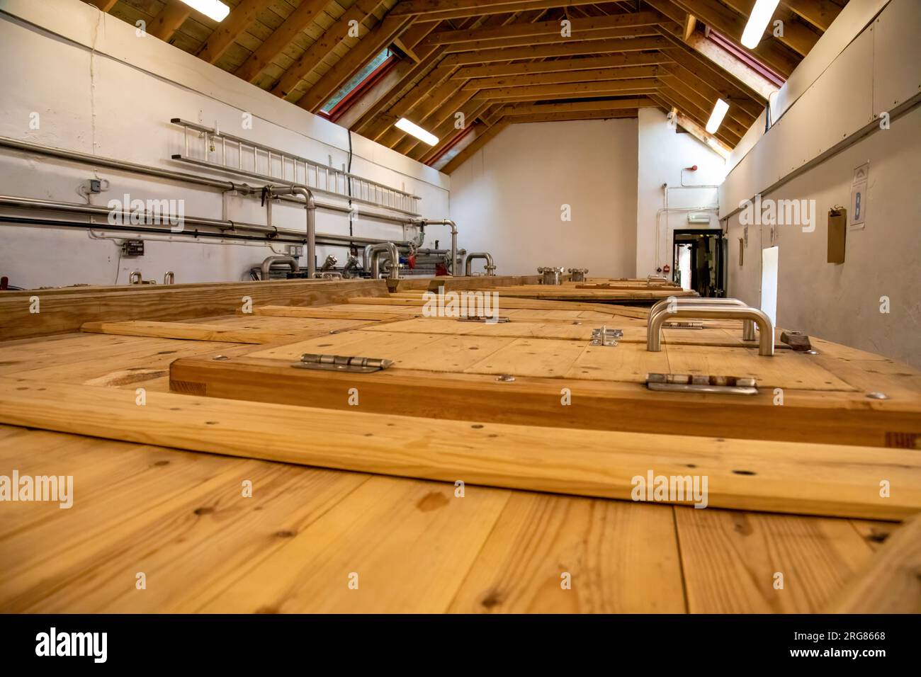 Inside a whisky distillery with vats made of wood in a warehouse Stock ...