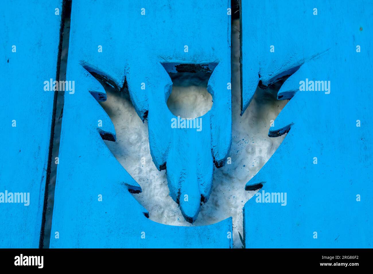 Blue wooden window shutter with cut out thistle design Stock Photo - Alamy