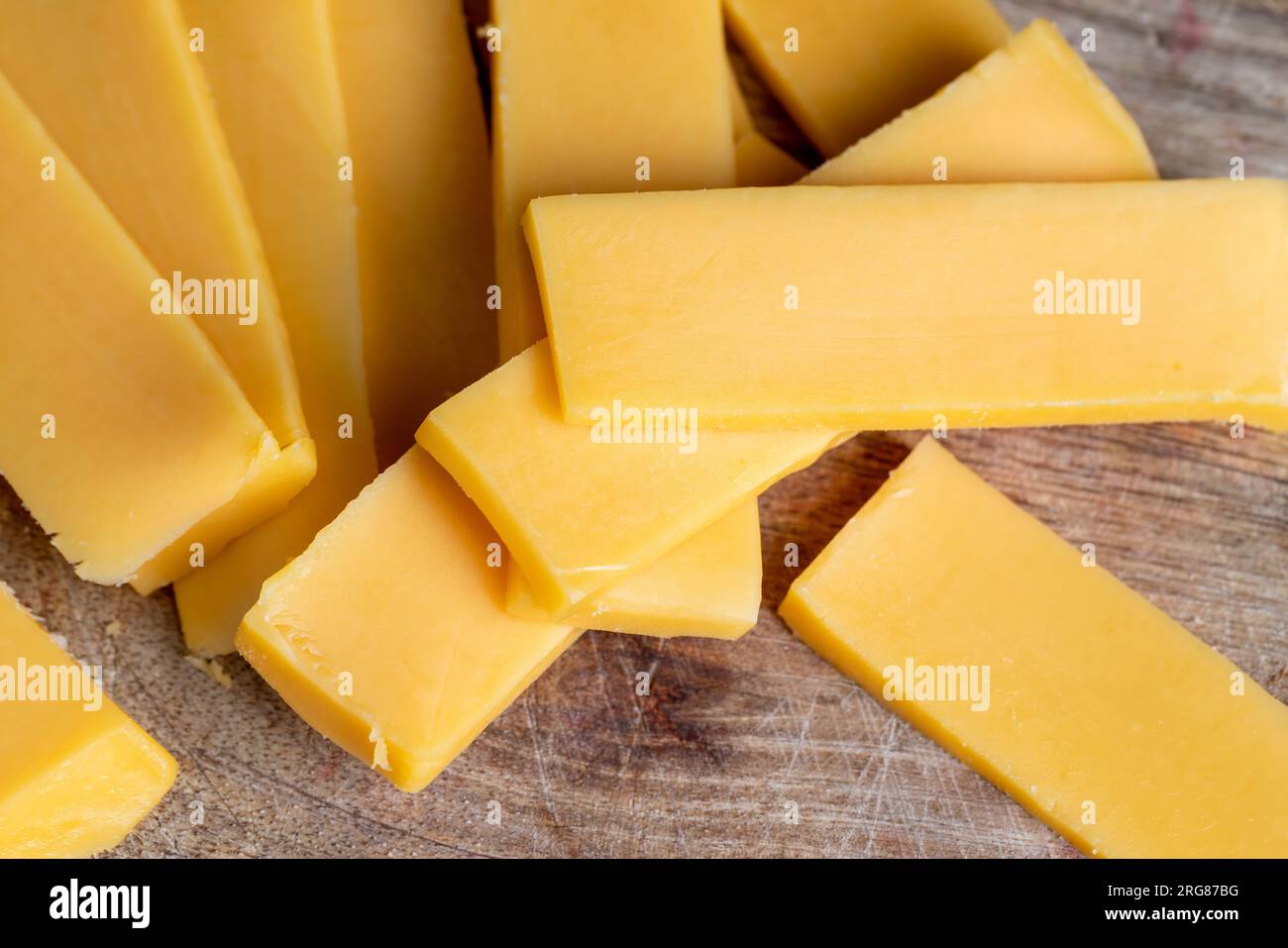 Sliced yellow cheese made from cow's milk, solid quality yellow cheese ...