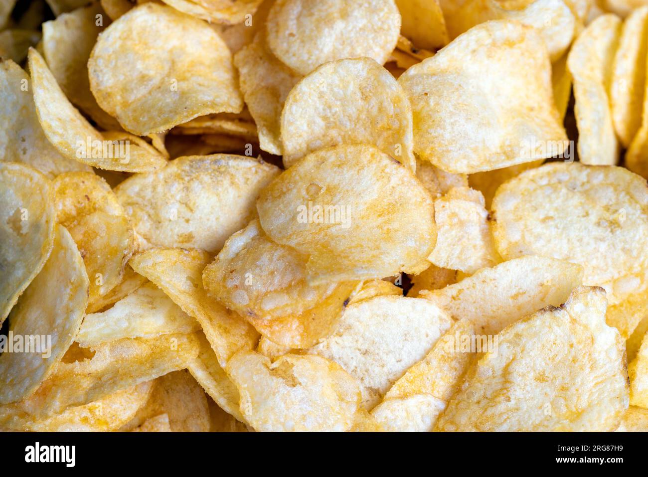 scattered potato chips with natural spices , fried potato chips with ...