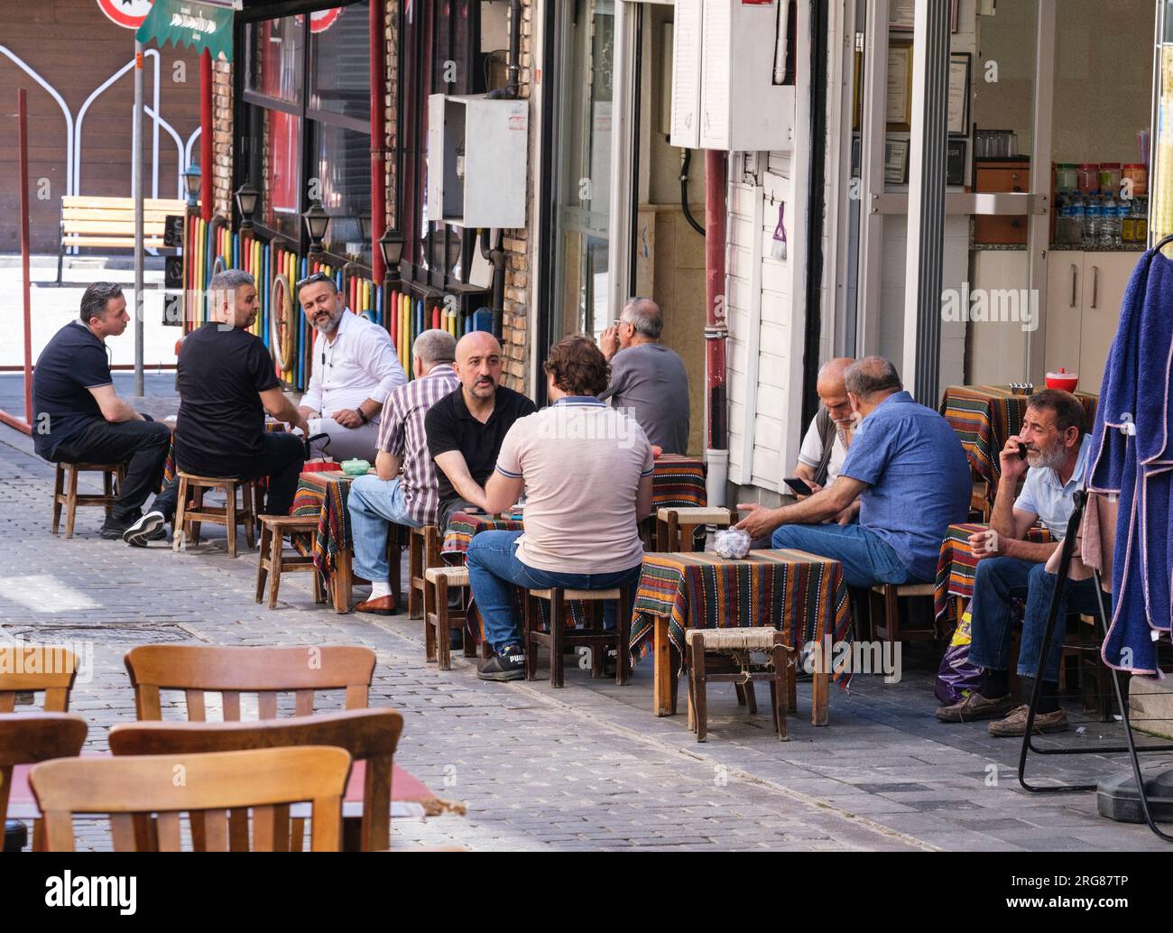 Istanbul, Turkey, Türkiye. Uskudar Street Scene. Men at a Sidewalk Cafe ...