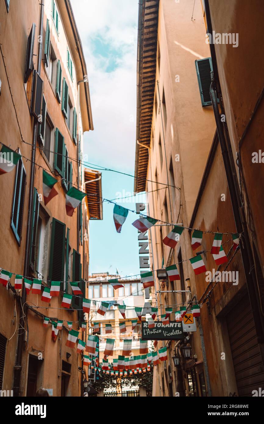 Holiday in the Italian city of streets with Italian flags and ancient ...