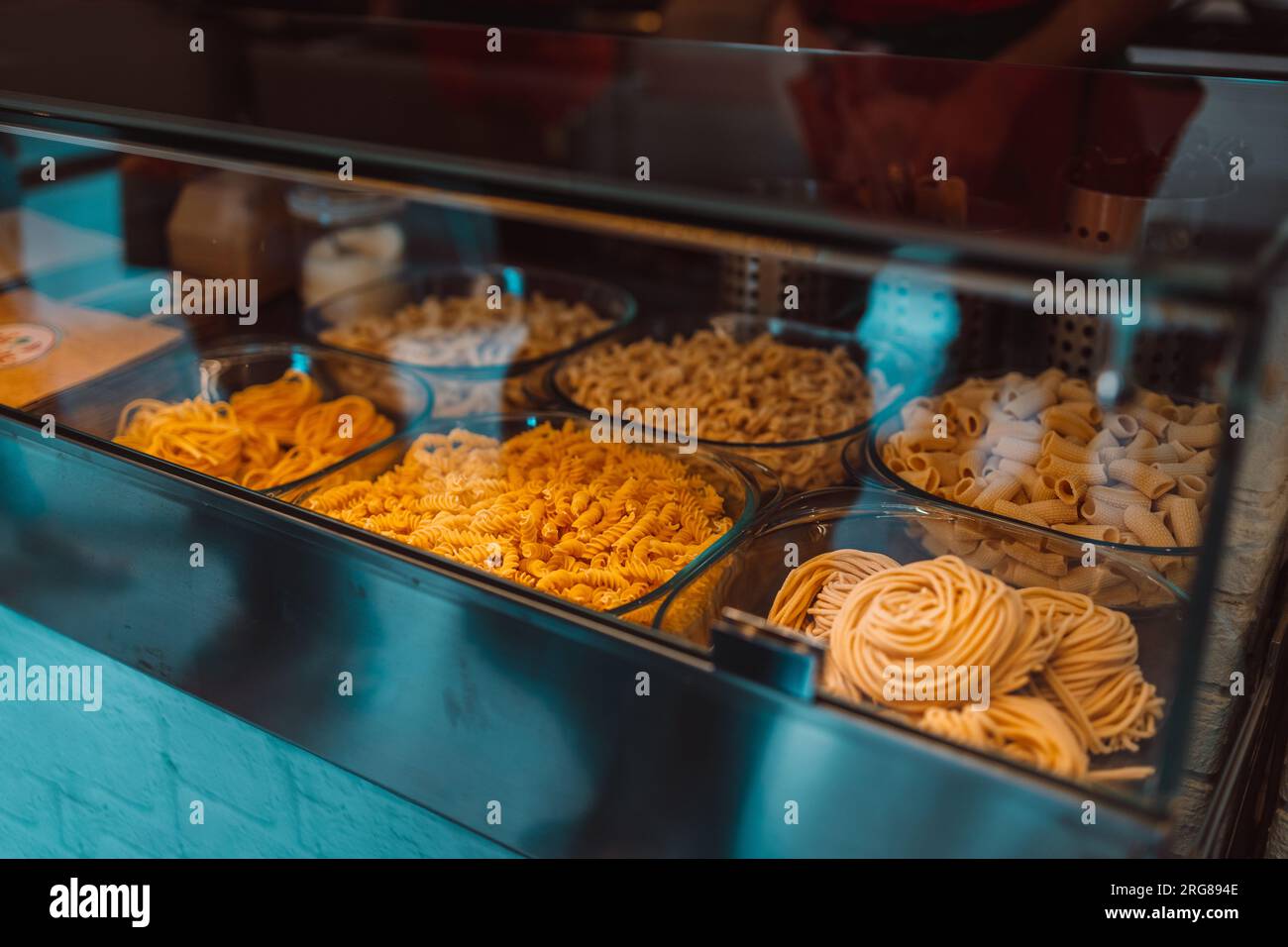Italian food. Homemade pasta in a shop display at a farmer's market in ...