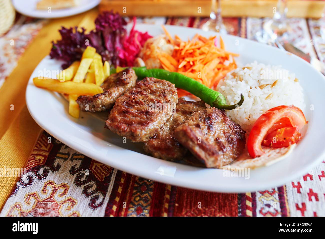 Delicious Turkish kofta served with rice and vegetables in a restaurant ...