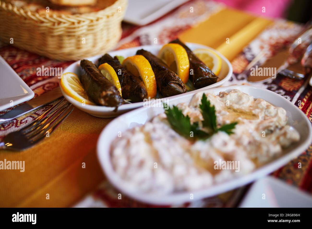 Delicious Turkish dolma served with yoghurt sauce in a restaurant of ...