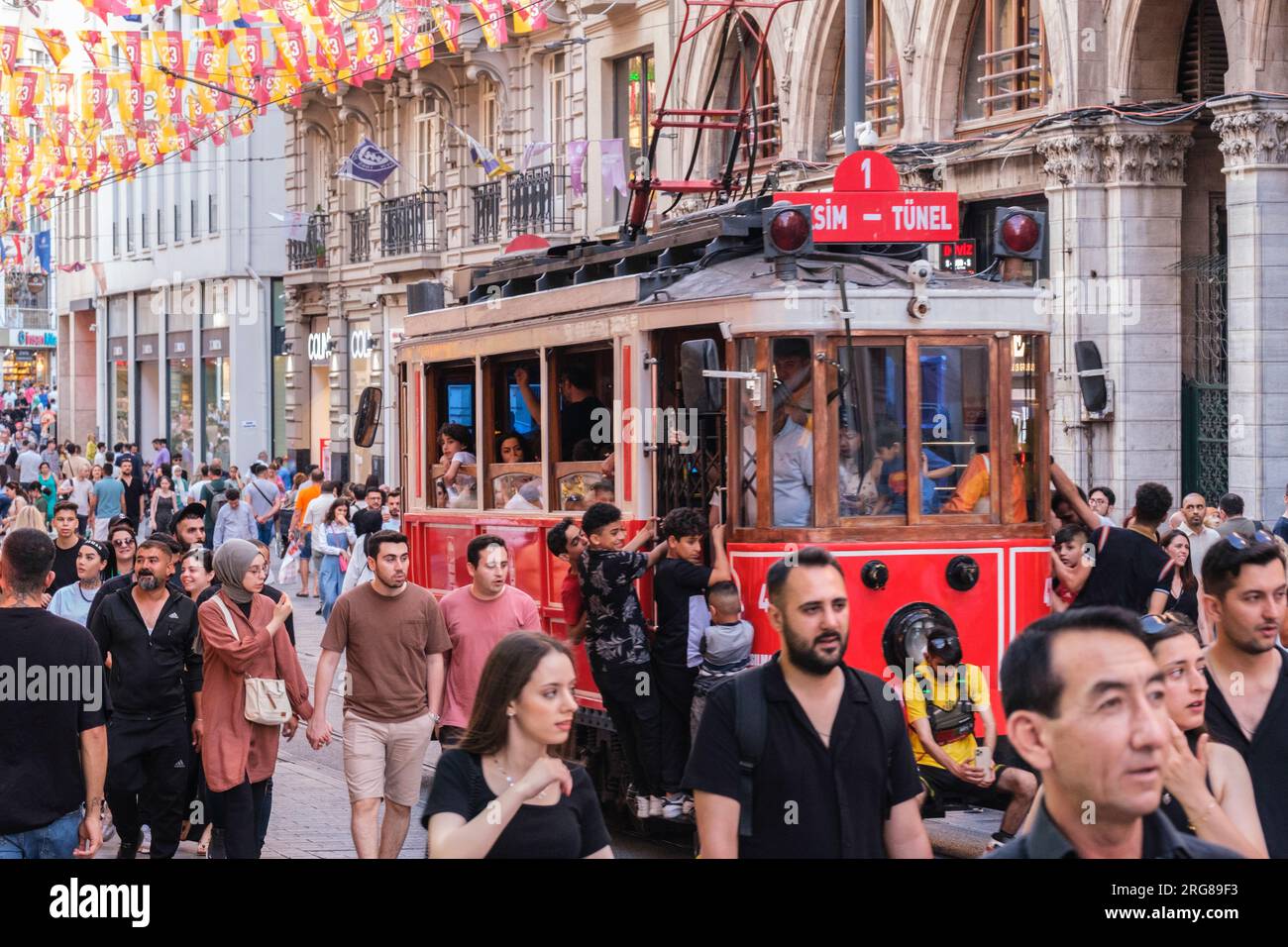 Istanbul, Turkey, Türkiye. Istiklal Street, Young Boys Hitching a Ride ...