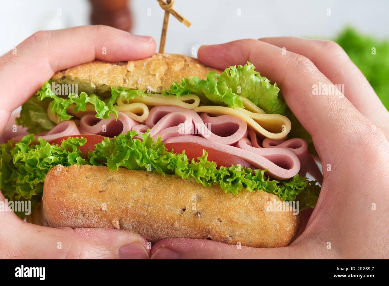 Hands holding big hamburger hi-res stock photography and images - Alamy