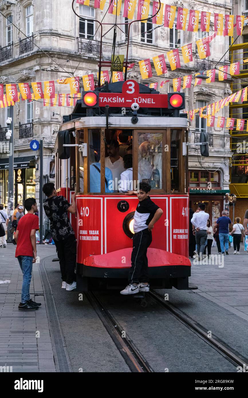 Istanbul, Turkey, Türkiye. Istiklal Street,Young Boys Hitching a Ride ...
