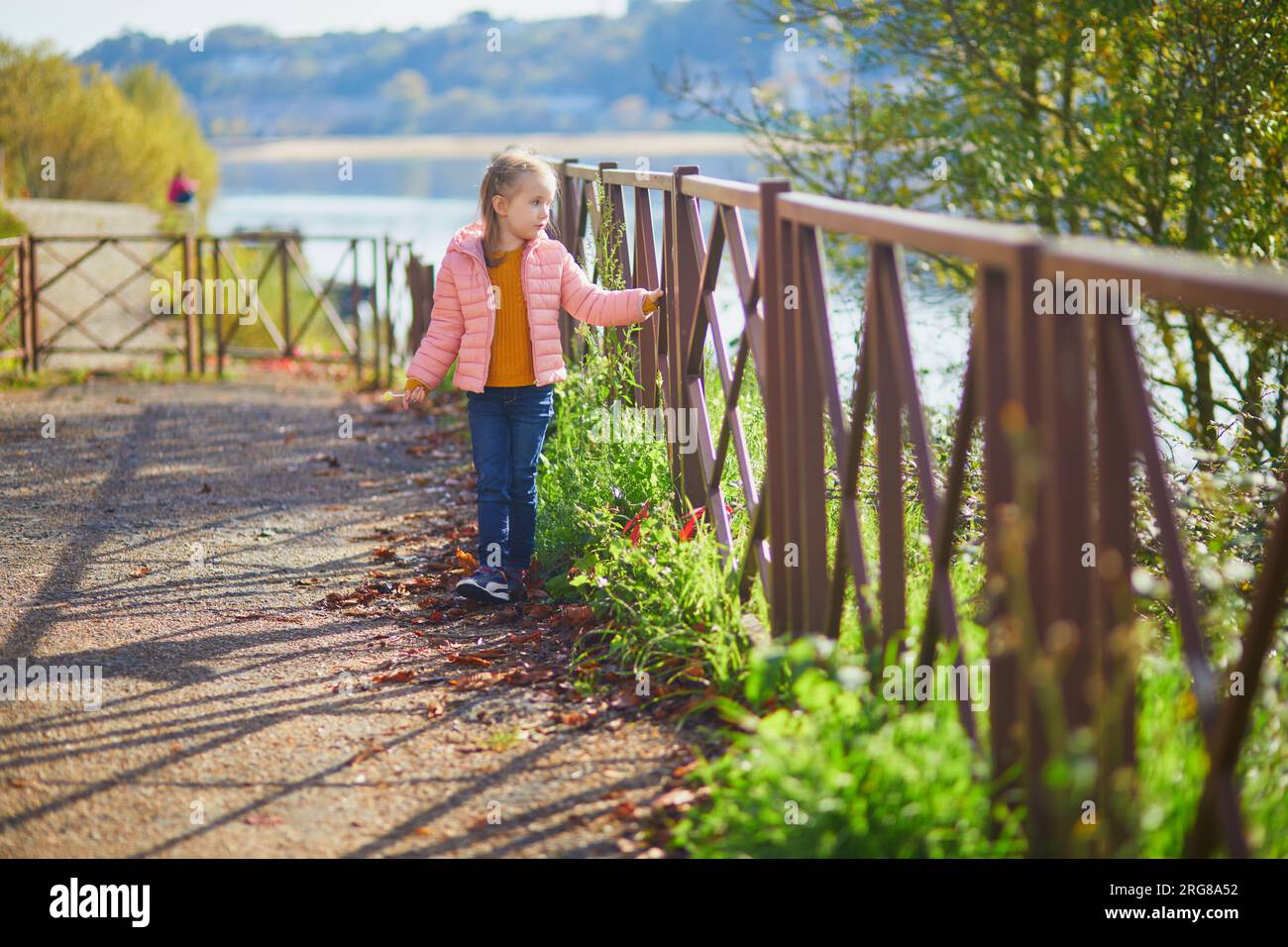 Adorable preschooler girl enjoying nice autumn day in Saumur, Maine-et ...