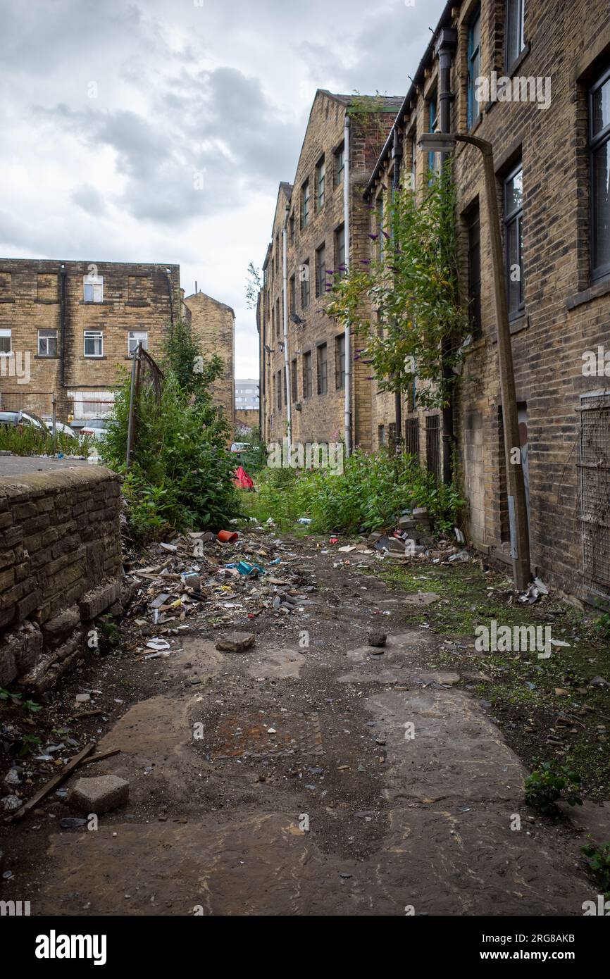 Wasteland alleyway on back street behind some old factory/mill ...