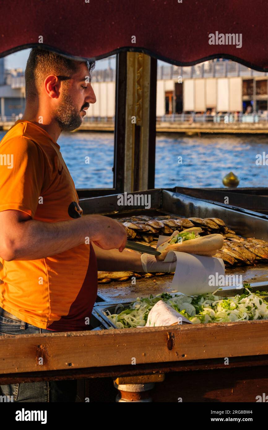 Istanbul, Turkey, Turkiye. Cook Frying Fish, Making Fish Sandwiches for ...