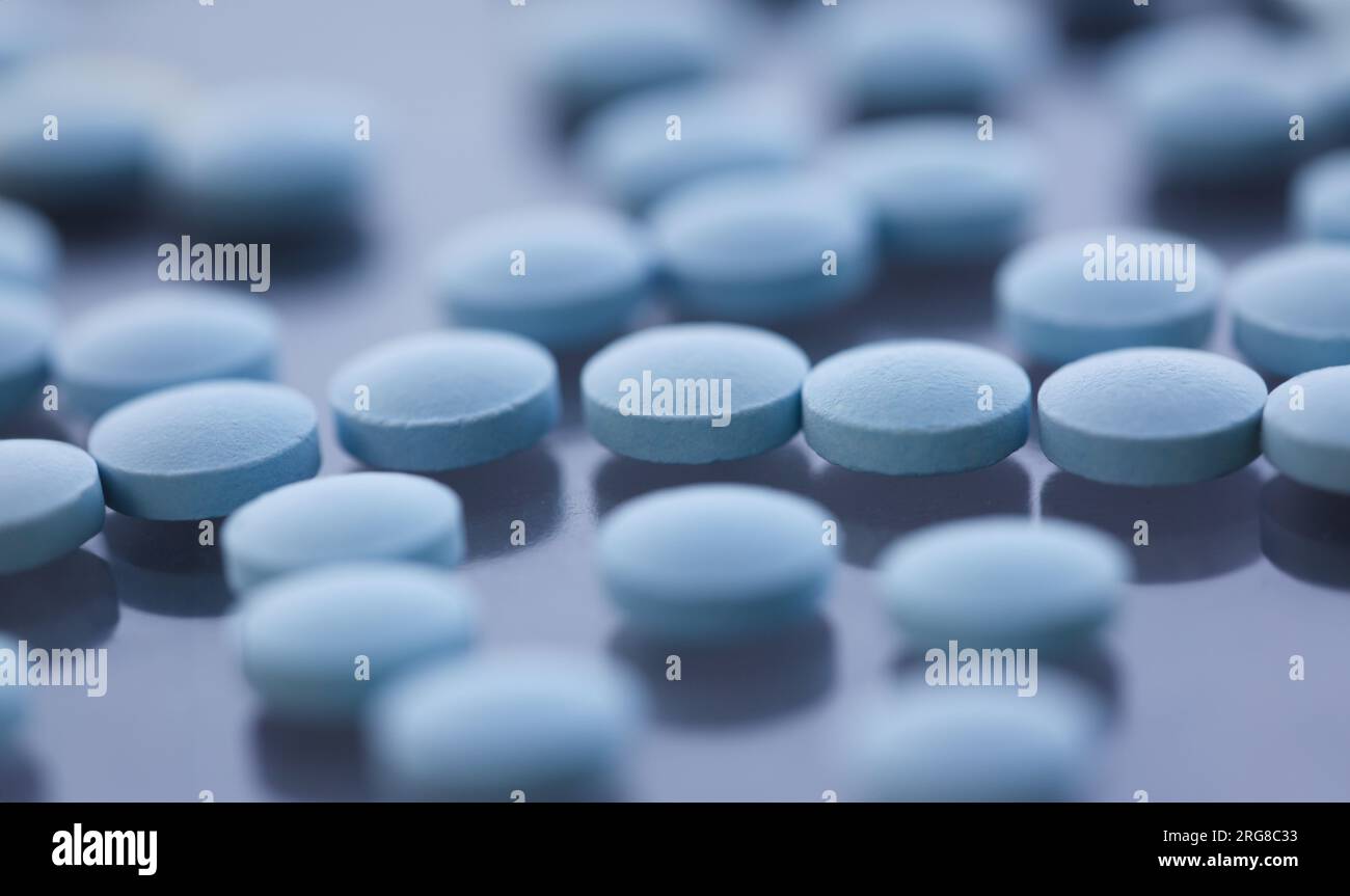 Tablets scattered on the table of the Stock Photo - Alamy