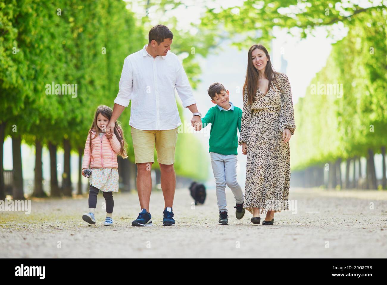 Happy family of four enjoying their trip to Paris, France. Mother ...