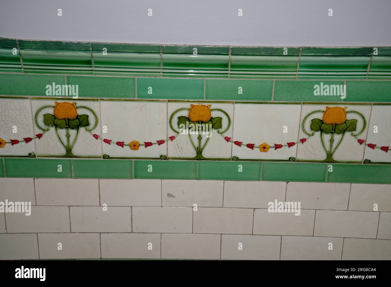 Glazed wall tiles of late Victorian or Edwardian design Stock Photo - Alamy