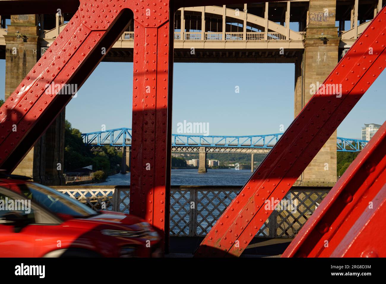 The Swing Bridge in Newcastle. Red and white painted metal road bridge ...