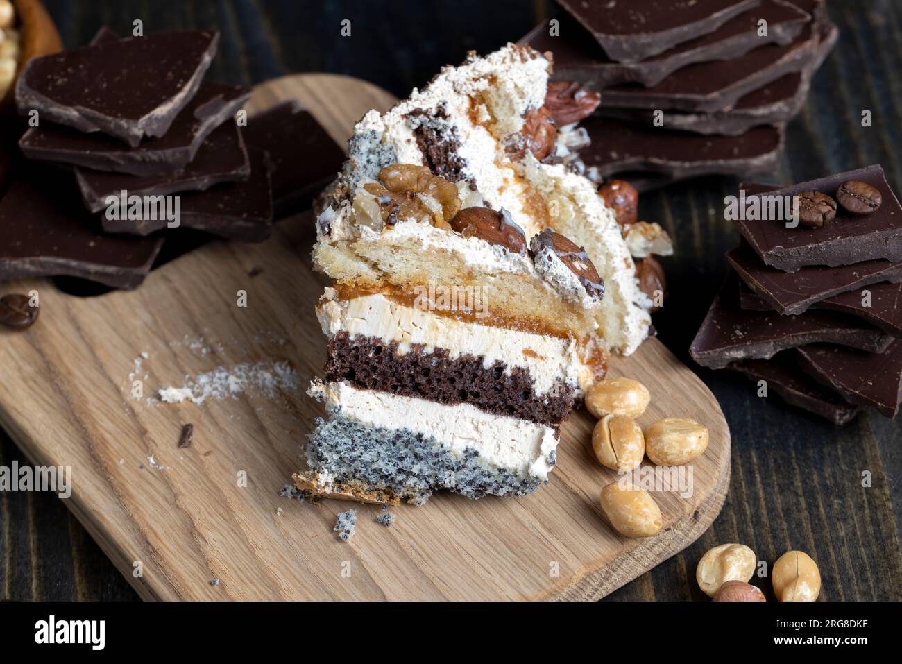 multi-layer cake with different layers, caramel, poppy seeds and cream ...