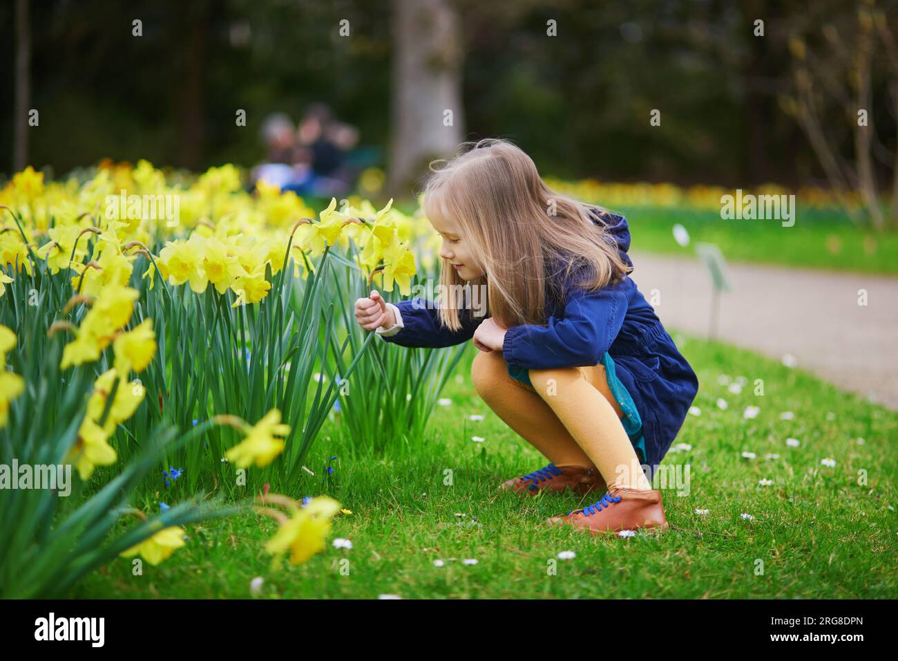 Adorable preschooler girl enjoying nice spring day in park during ...