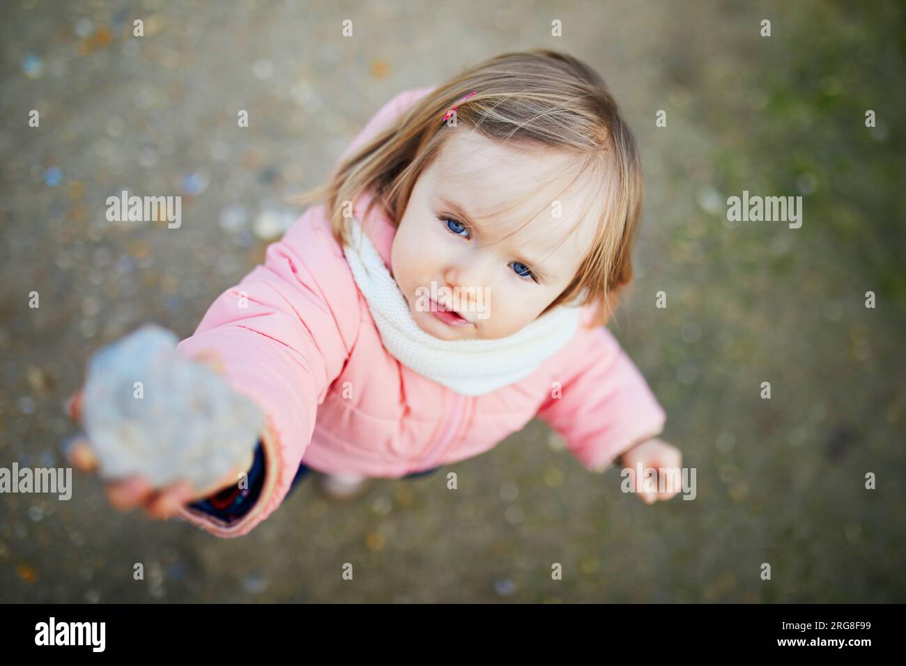 Child collecting stones hi-res stock photography and images - Alamy
