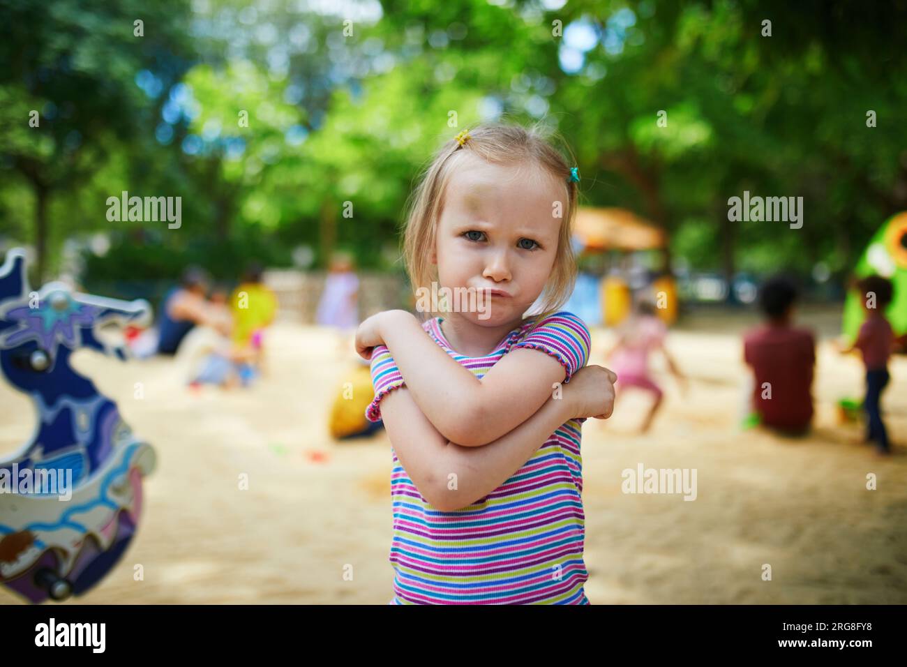 Cute little girl with bruise on her forehead after falling down. Child ...