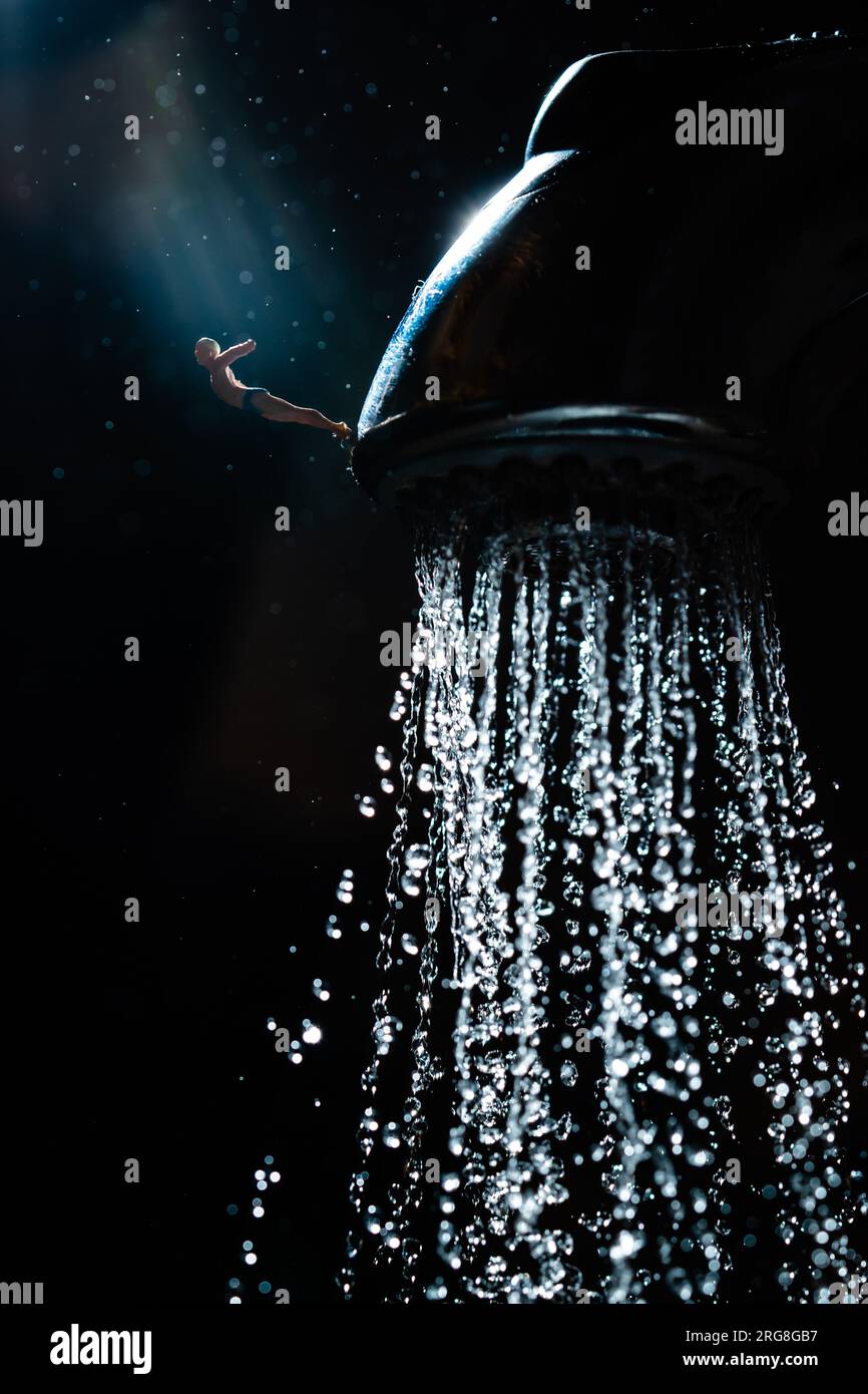 Faucet Diver Miniature Olympic diver jumps off a Faucet with running ...