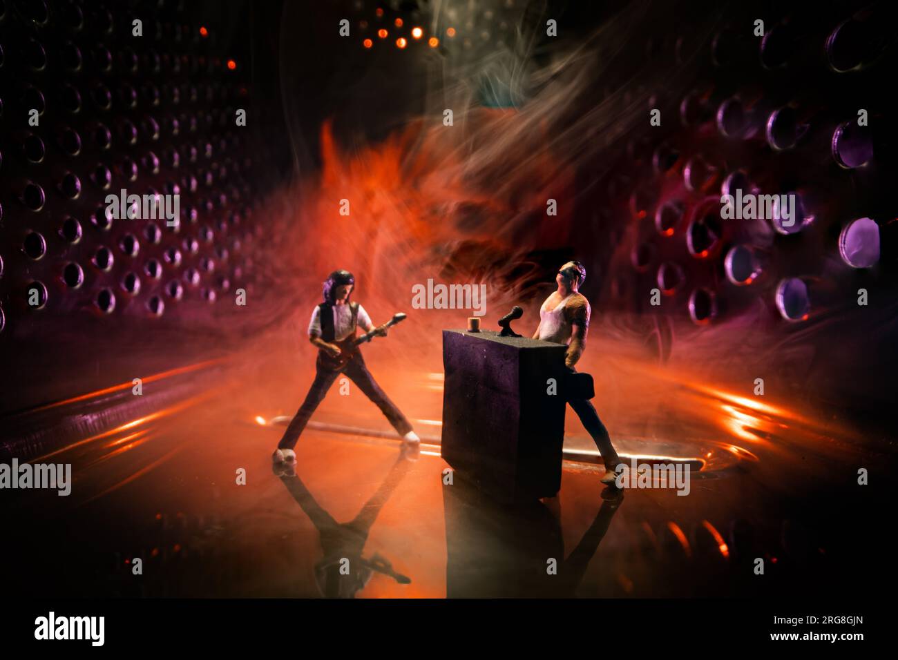 The Show Must Go On Miniature rock band performing in a large venue ...