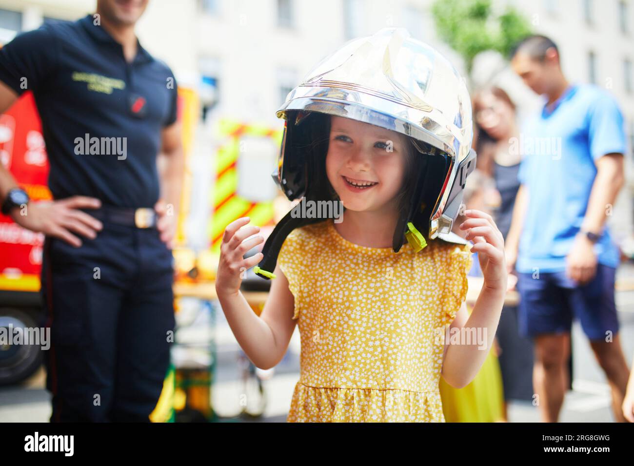 Adorable preschooler girl acting like a fireman and wearing a ...
