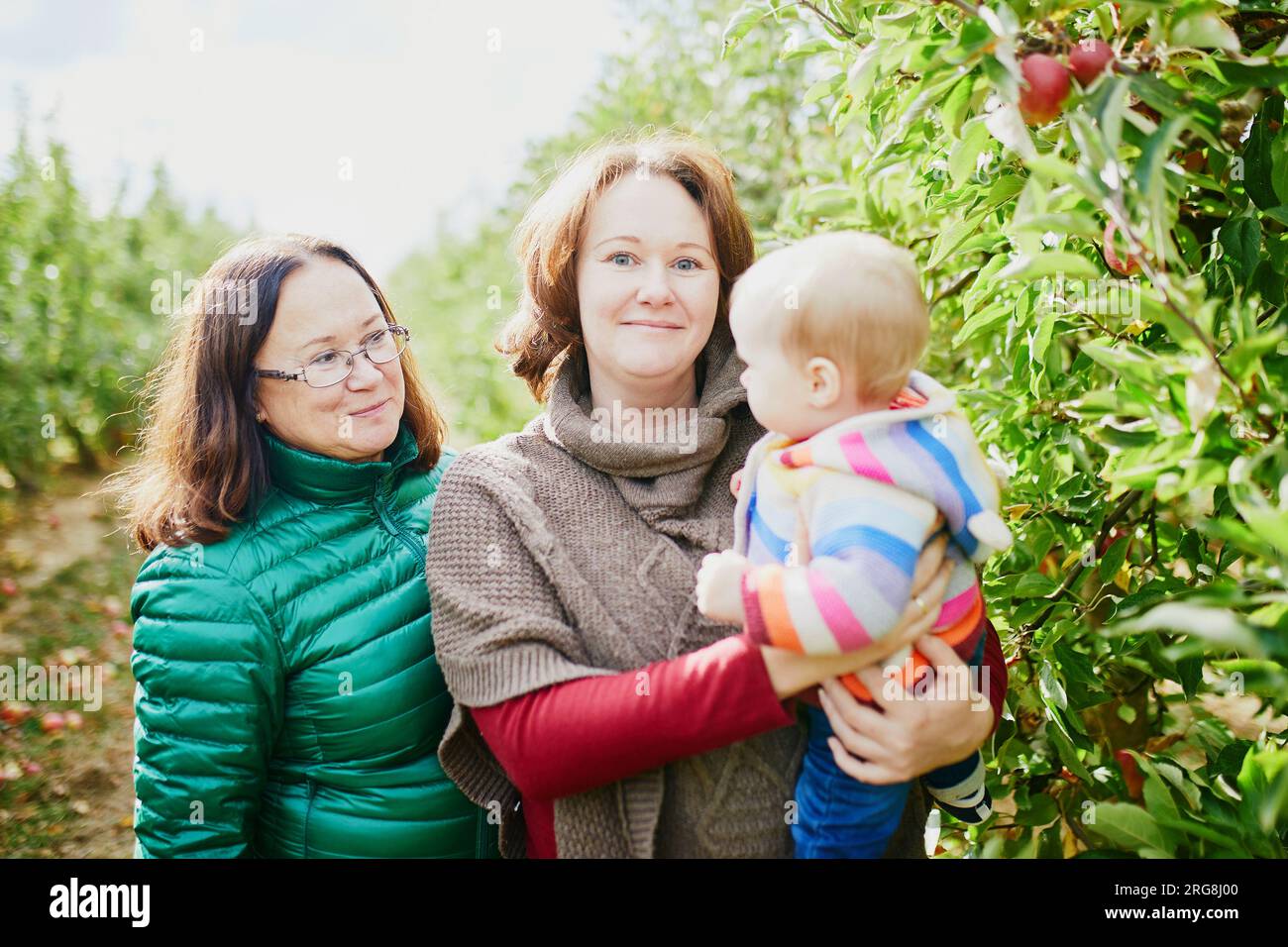 Three generations family - grandmother, mother and granddaughter ...
