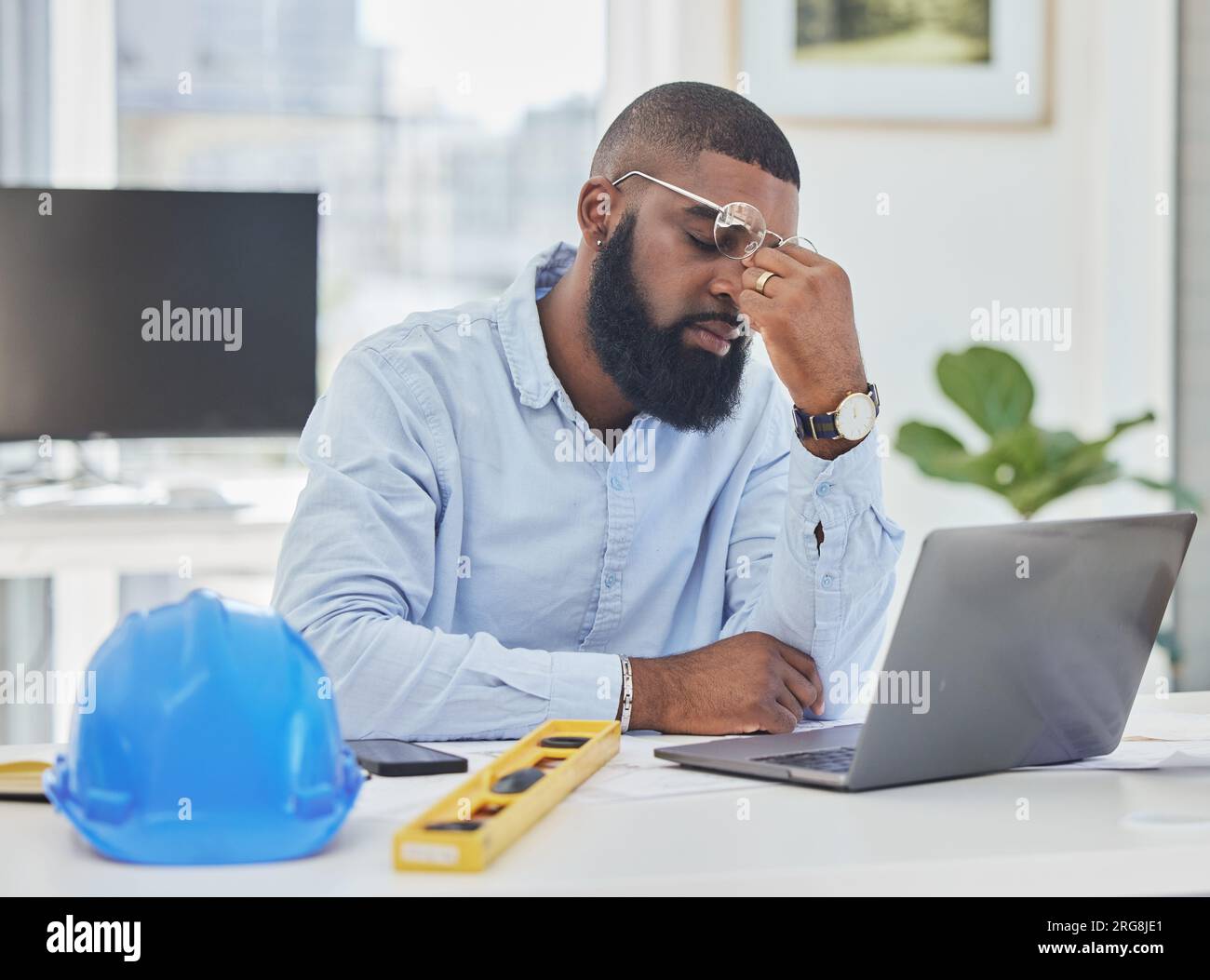 Architecture, tired and headache with black man and laptop for stress ...