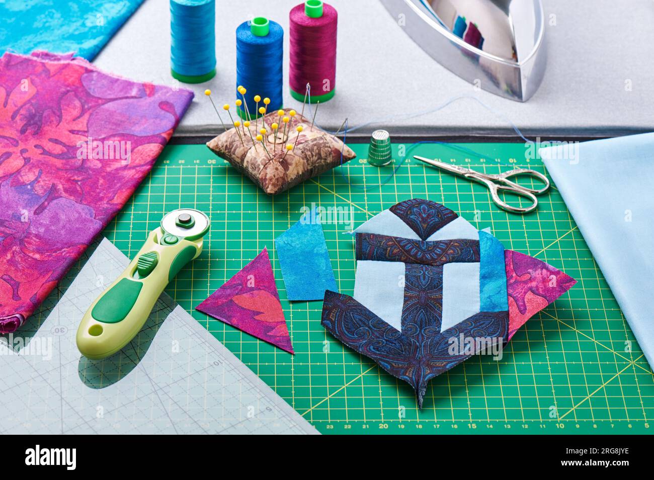 Sewing patchwork of block anchor surrounded by accessories Stock Photo ...