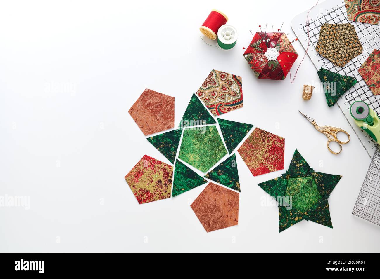 Preparation of pentagon and triangular pieces of fabric for sewing ...